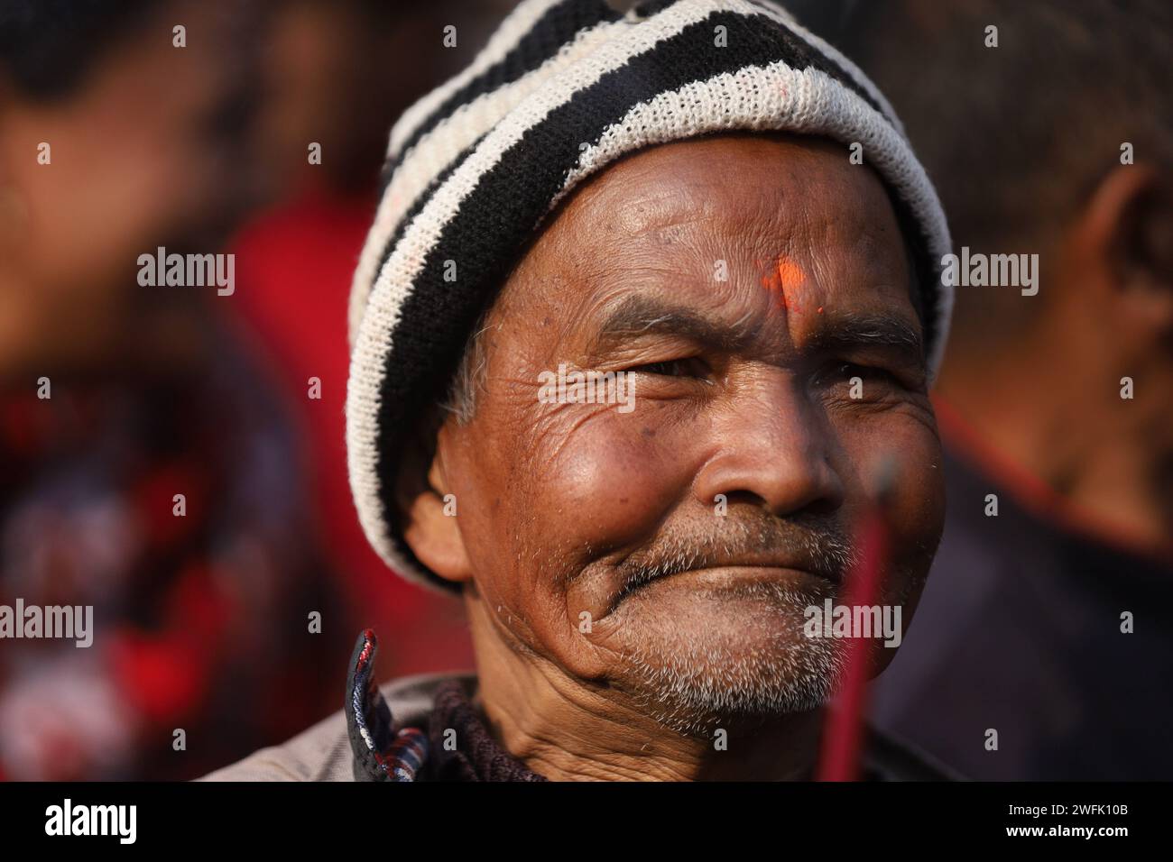 Nepal s Red God returns back to Patan A devotee lights incencs sticks ...