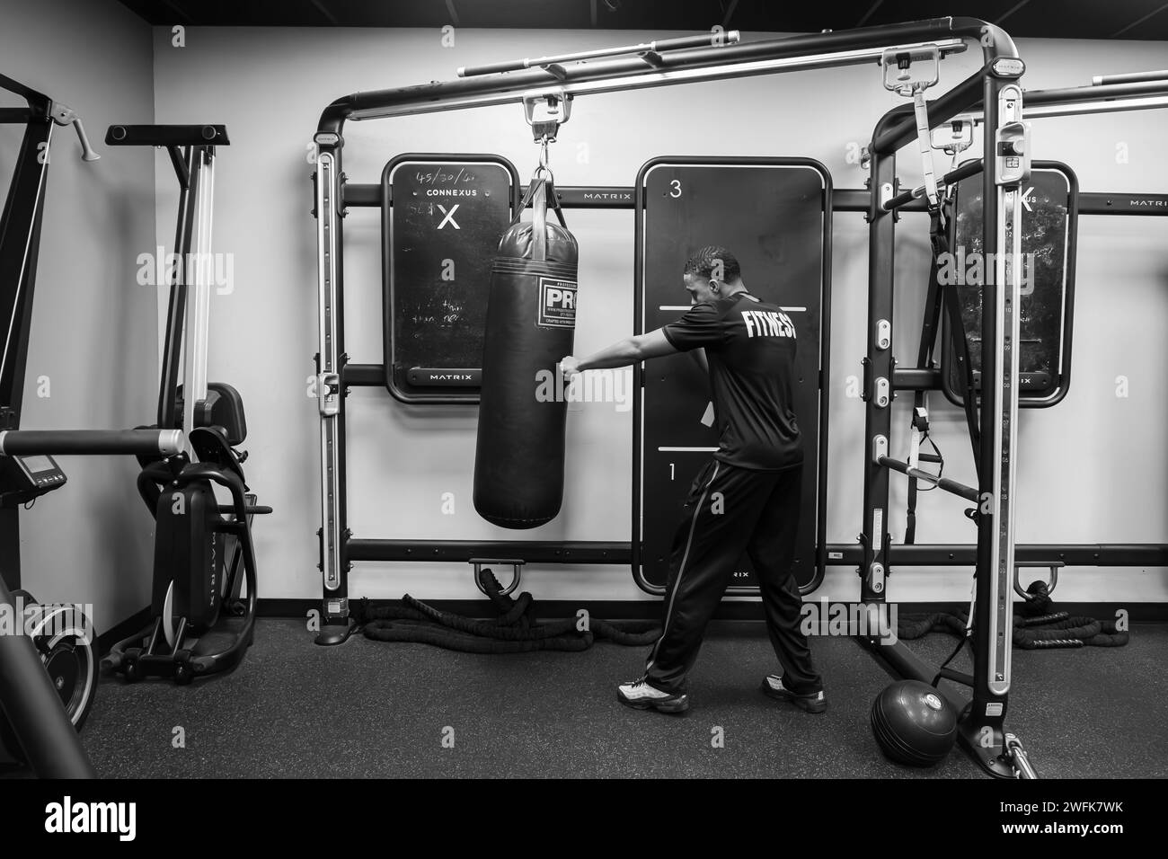 Fitness coach at the local gym during fitness training session Stock ...