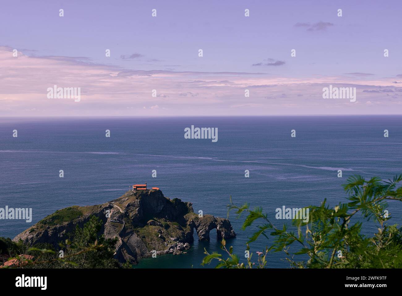 Hermitage of San Juan de Gaztelugatxe on a sunny day. calm sea, rocky ...