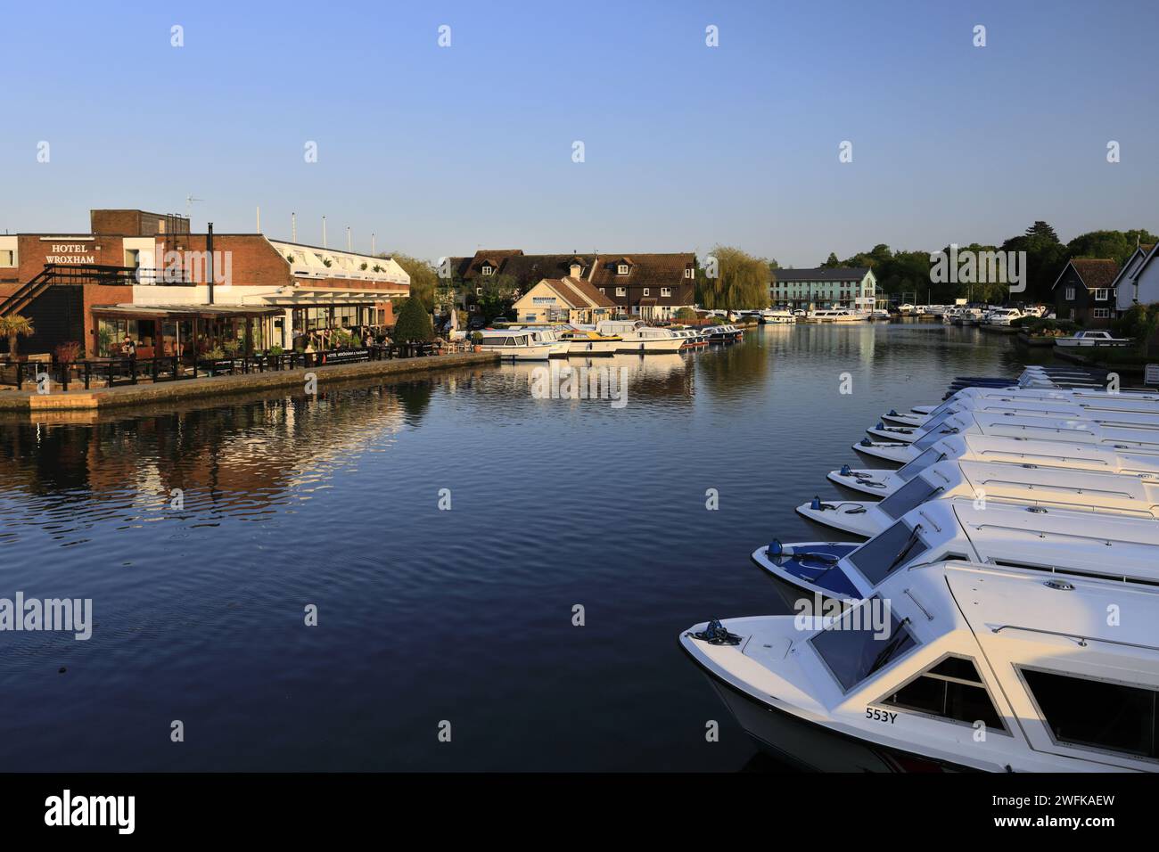 Pleasure boats on the River Bure at Wroxham town in the Norfolk Broads ...