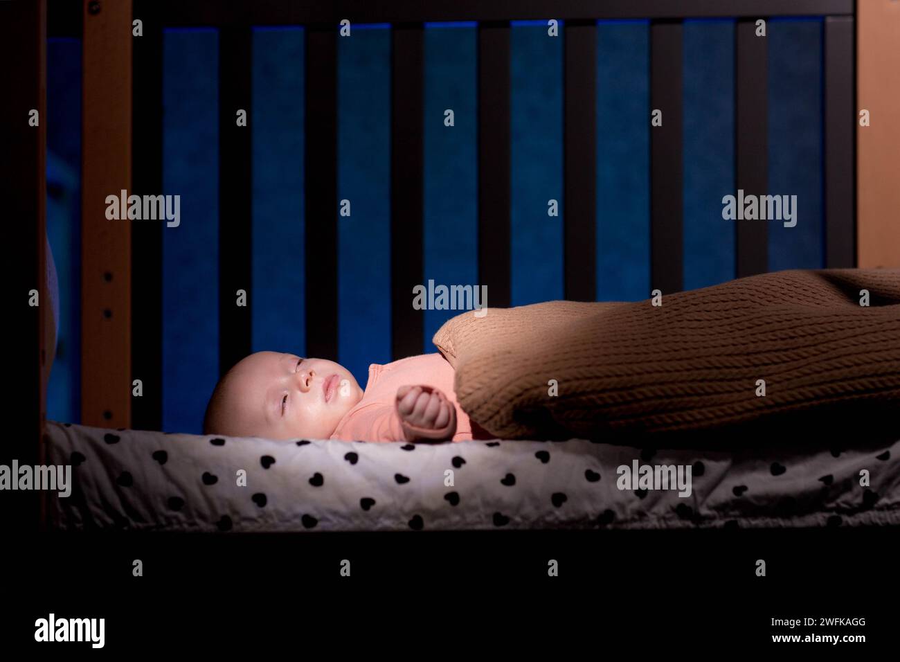 Cute little baby sleeping in cradle at home night Stock Photo - Alamy