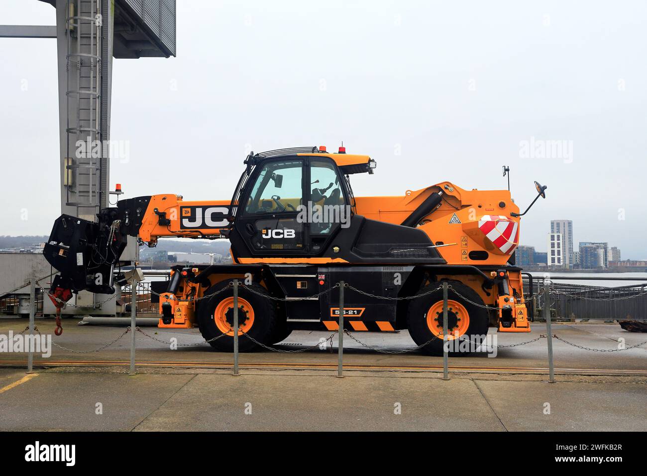 JCB crane / lifting vehicle parked on Cardiff Bay Barrage. Winter 2024 ...
