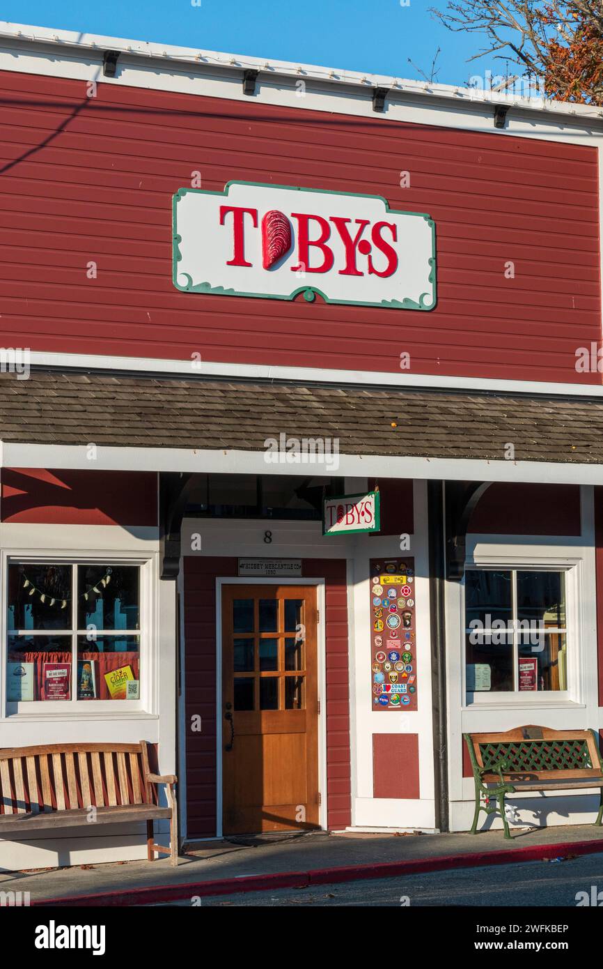 Vertical image of a red historic wooden building that houses Toby's ...