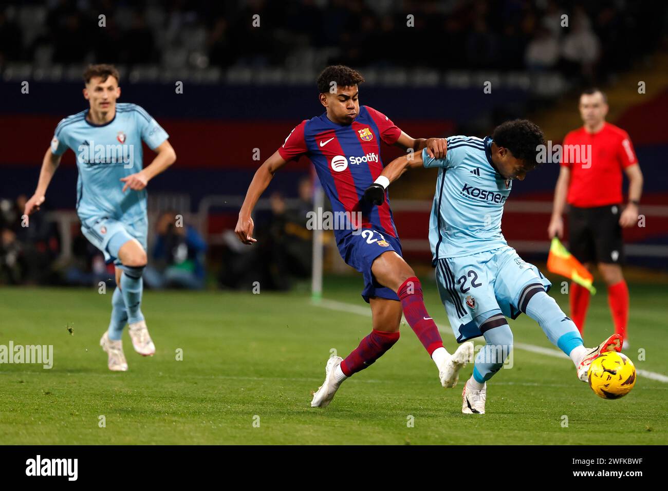 Barcelona's Lamine Yamal, left, and Osasuna's Johan Mojica fight for ...