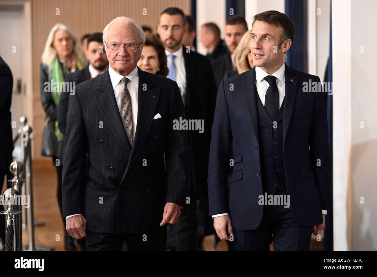 Sweden's King Carl Gustaf, left, and France's President Emmanuel Macron ...