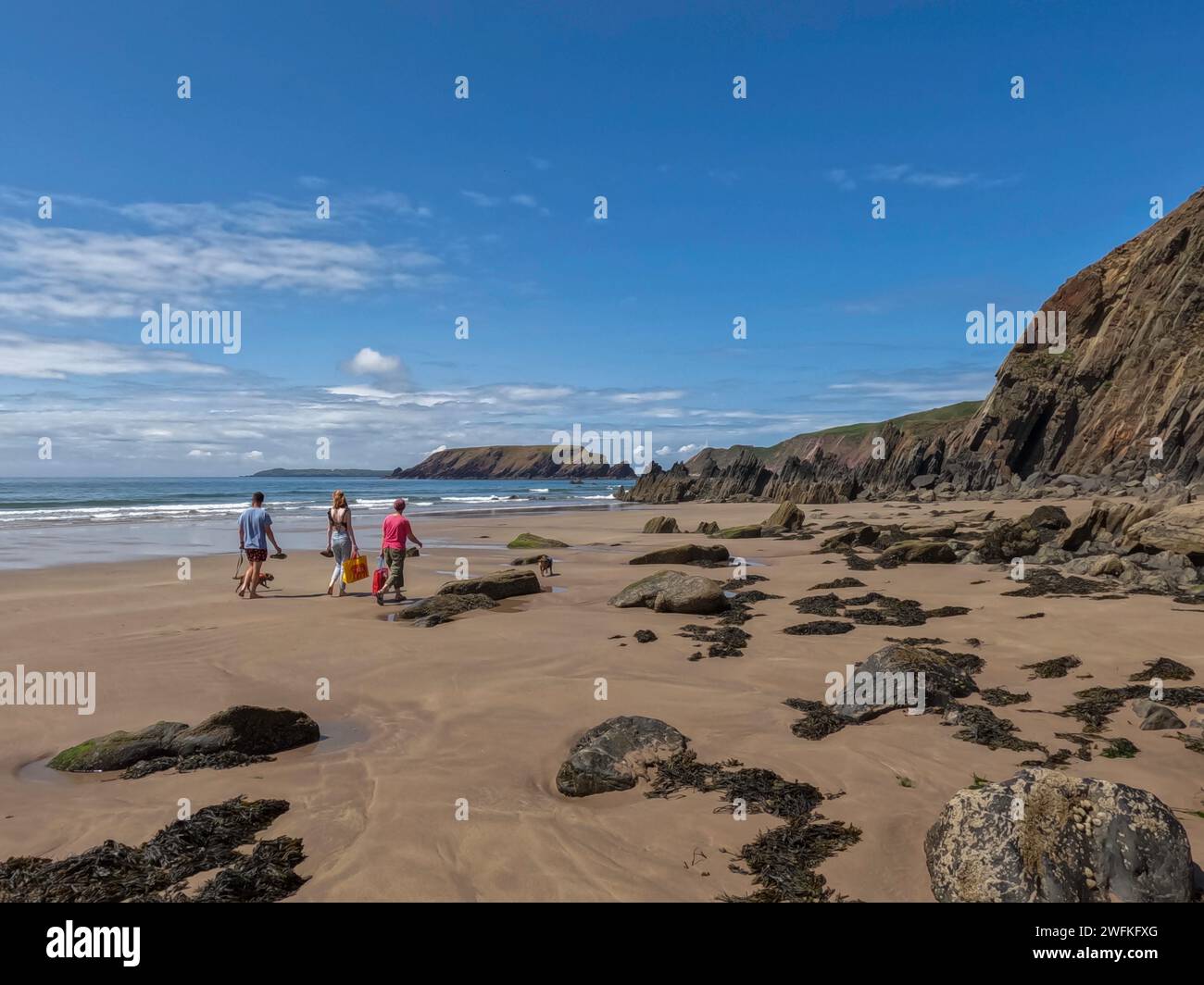 Holiday makers finding a spot on the beautiful sandy Marloes Sands ...