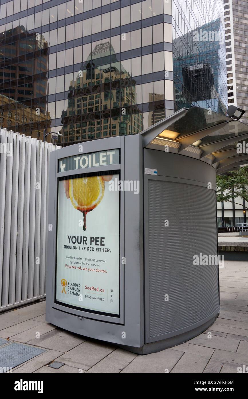 Outdoor public toilet cubicle with a bladder cancer awareness poster in ...