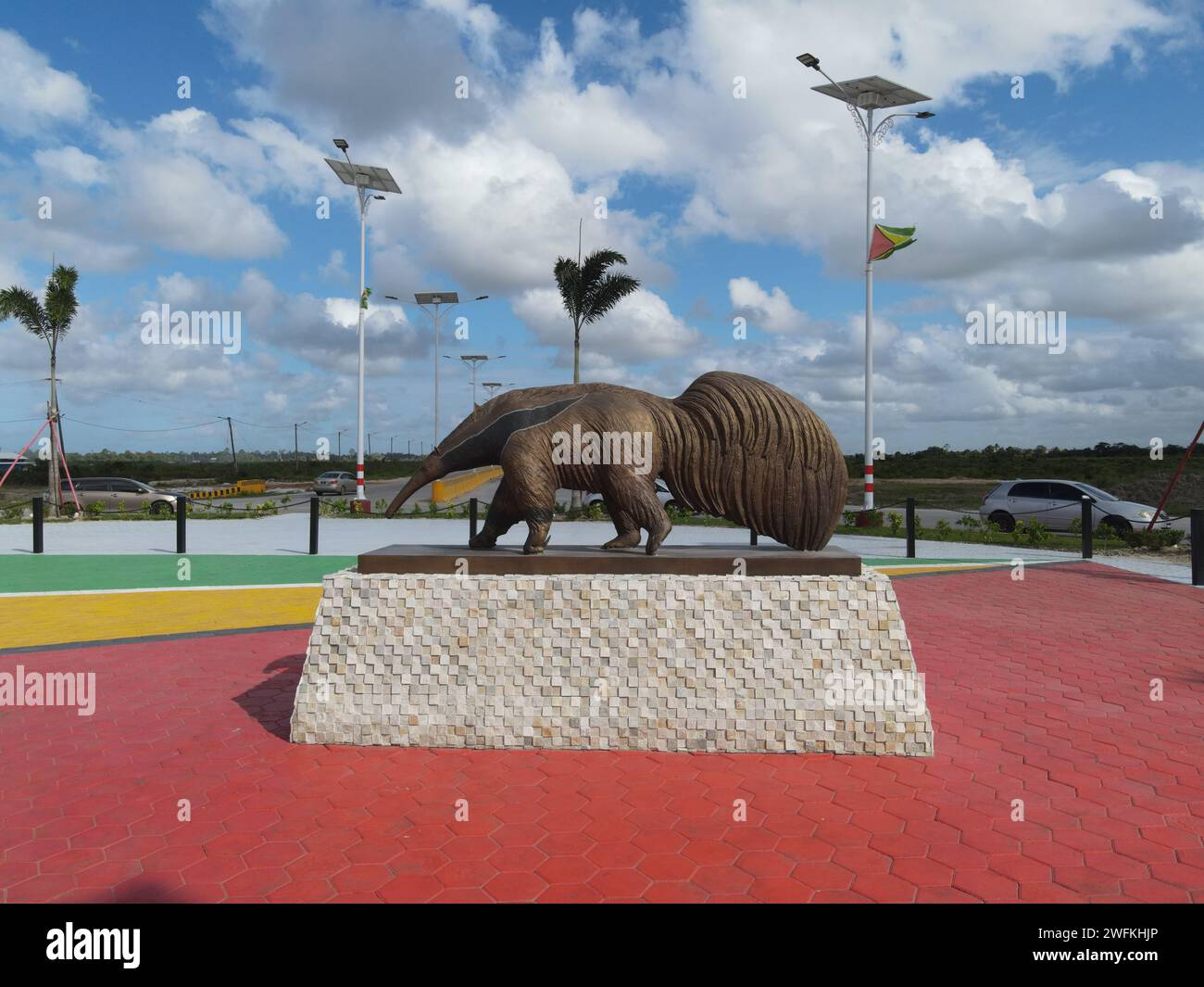 Statue of an armadillo stands amidst lush trees Stock Photo - Alamy