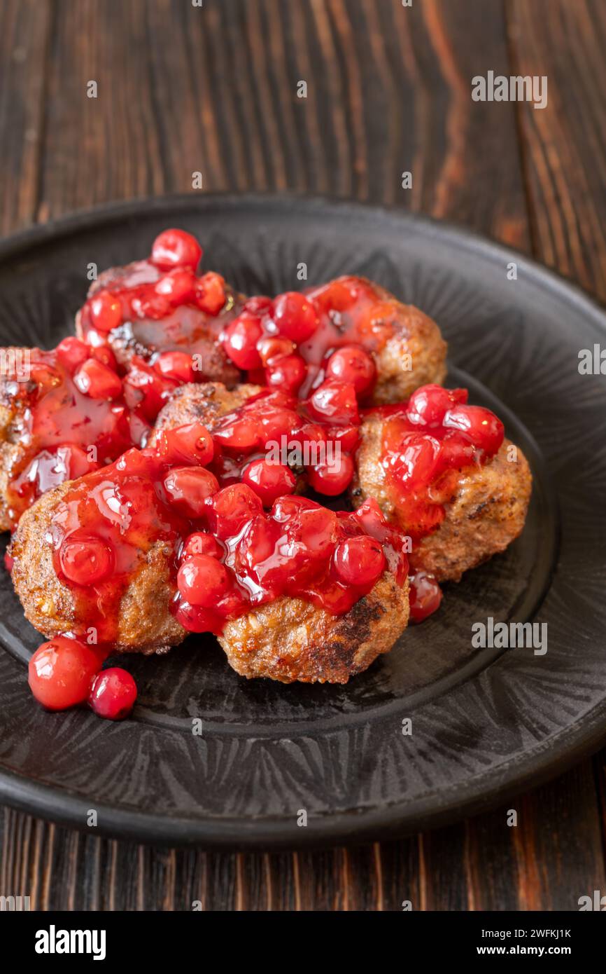 Portion of swedish meatballs with lingonberry sauce Stock Photo - Alamy