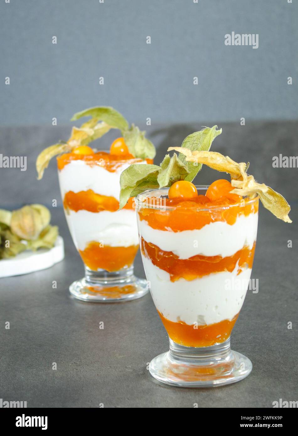 Layered dessert with protein yoghurt and physalis fruit Stock Photo - Alamy