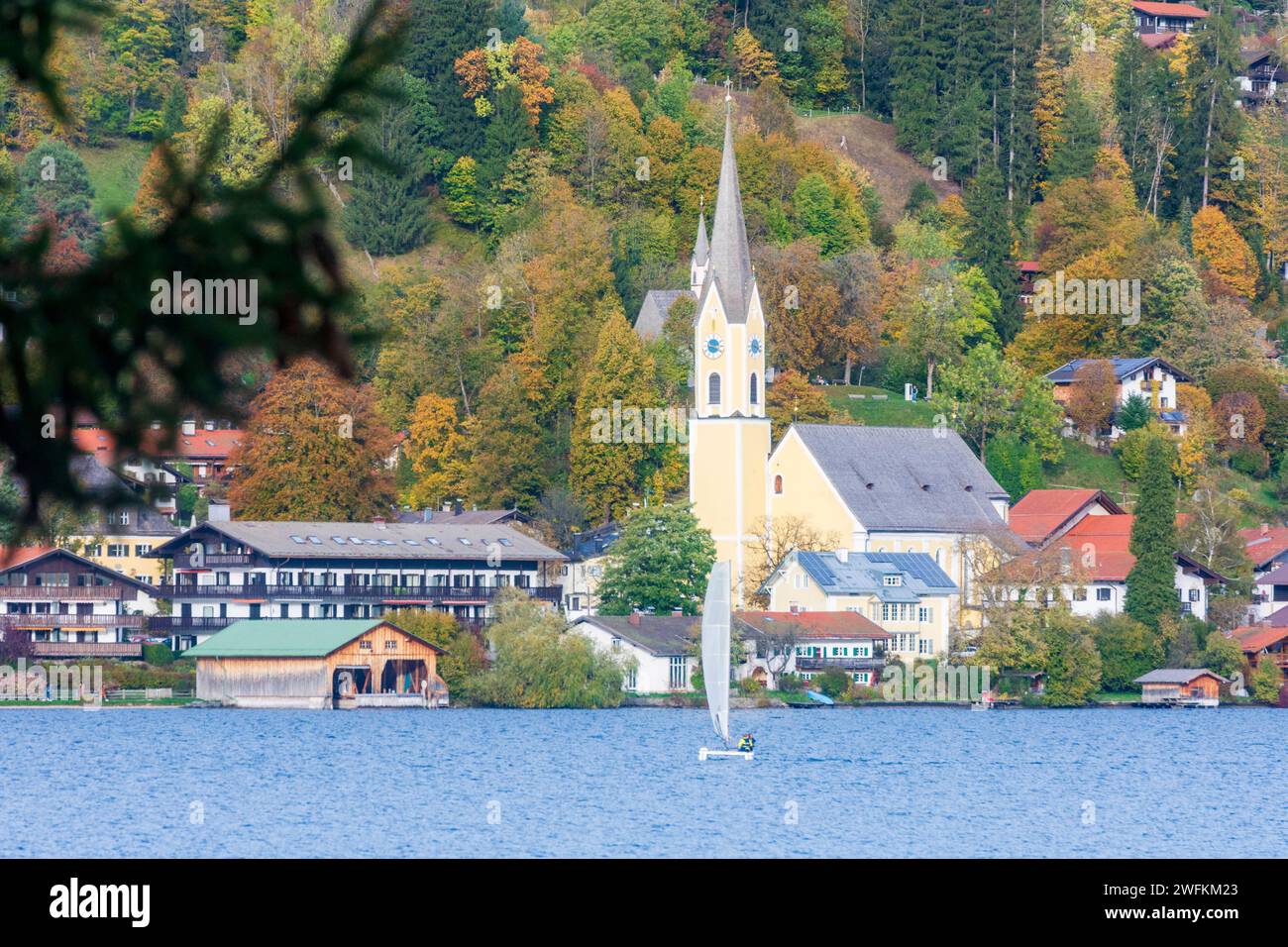 lake and church Schliersee, autumn colors, sailboat Stock Photo - Alamy