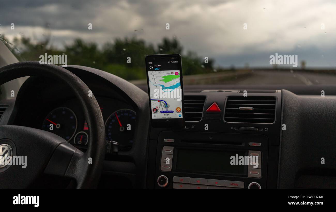 Waze maps showing the way thru the city. Driver using Waze maps Stock ...
