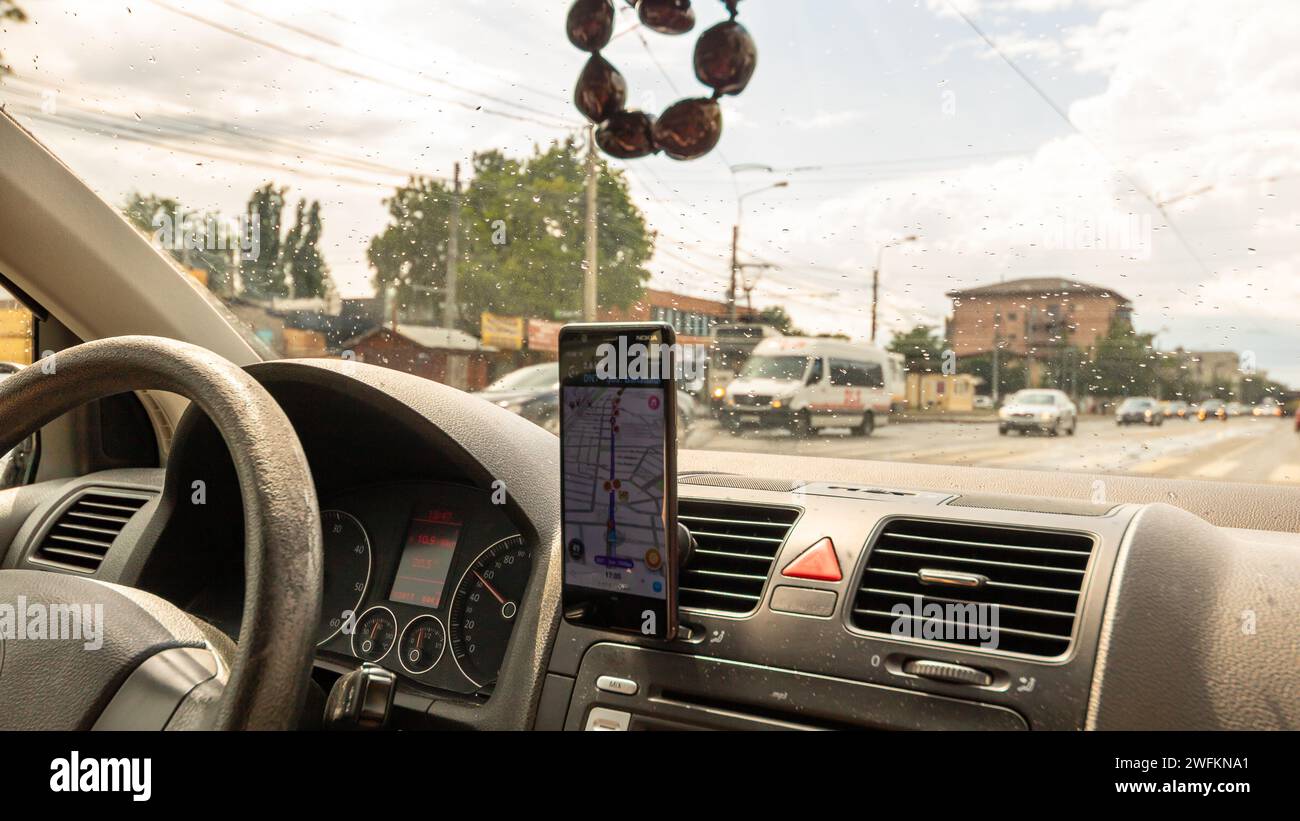 Waze maps showing the way thru the city. Driver using Waze maps Stock ...