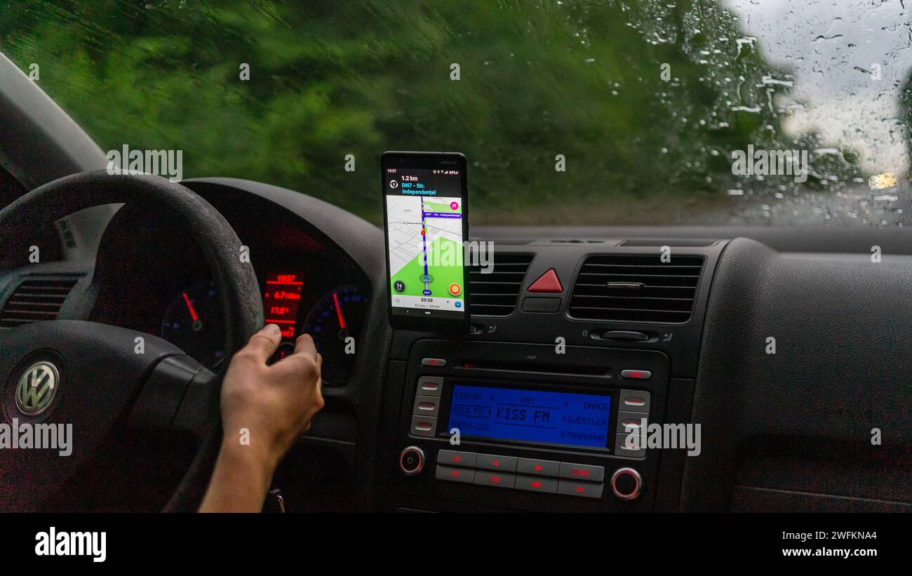 Waze maps showing the way thru the city. Driver using Waze maps Stock ...