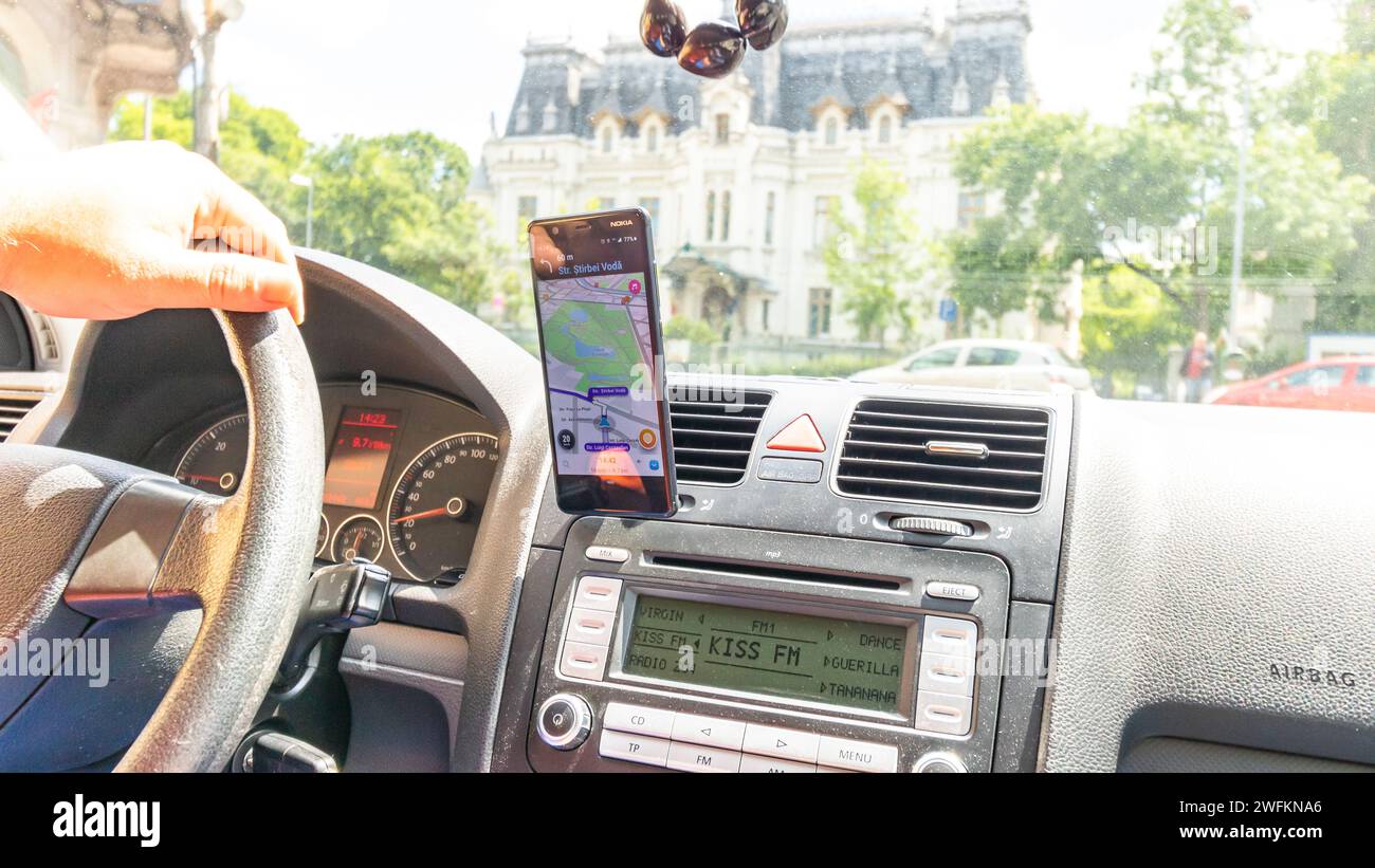 Waze maps showing the way thru the city. Driver using Waze maps Stock ...