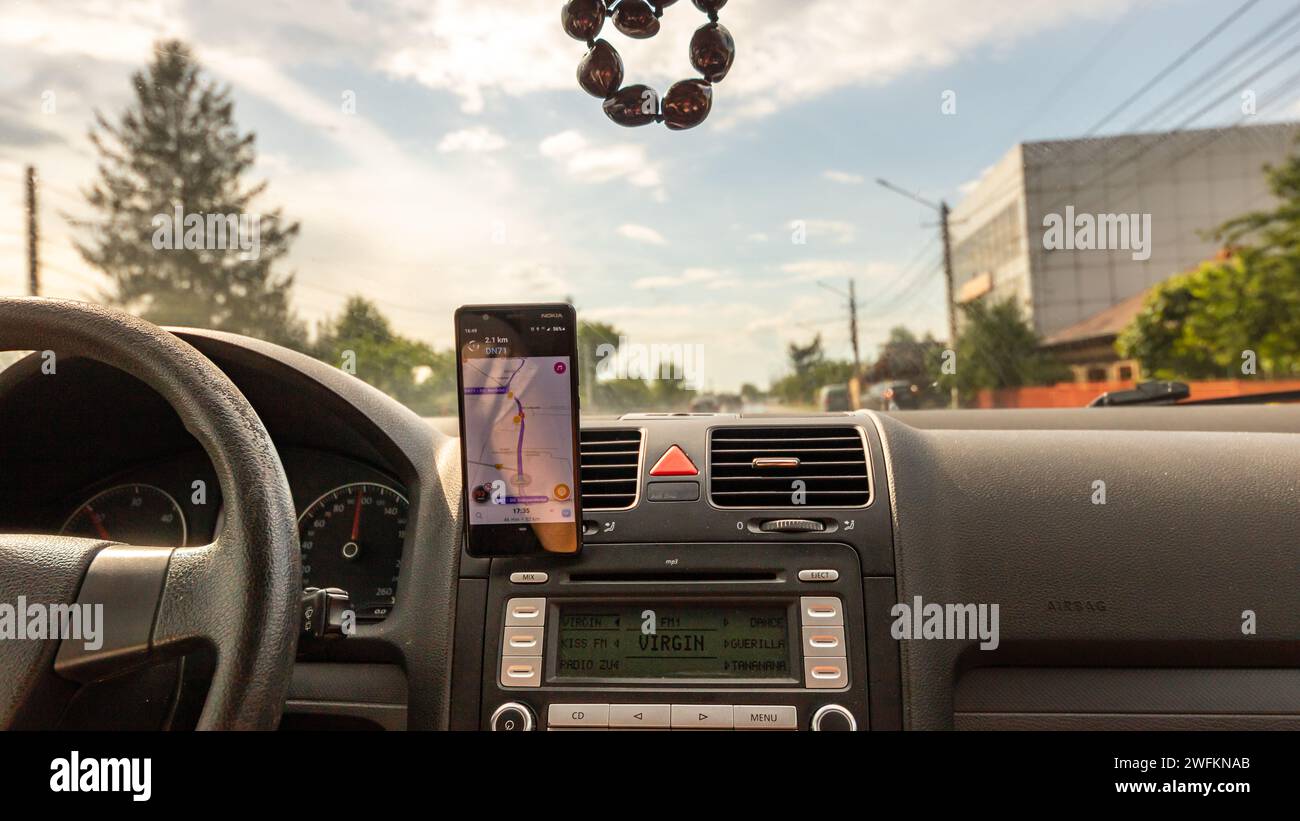 Waze maps showing the way thru the city. Driver using Waze maps Stock ...