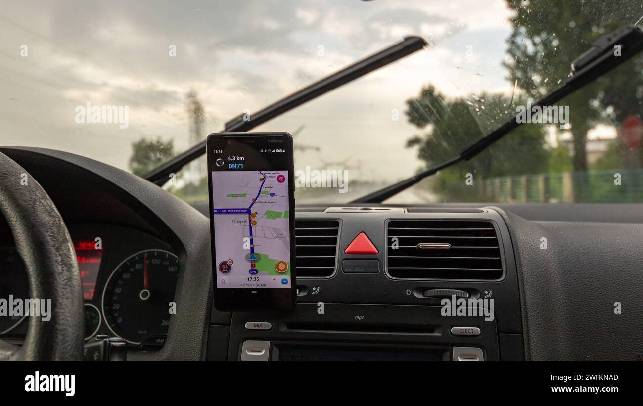 Waze maps showing the way thru the city. Driver using Waze maps Stock ...