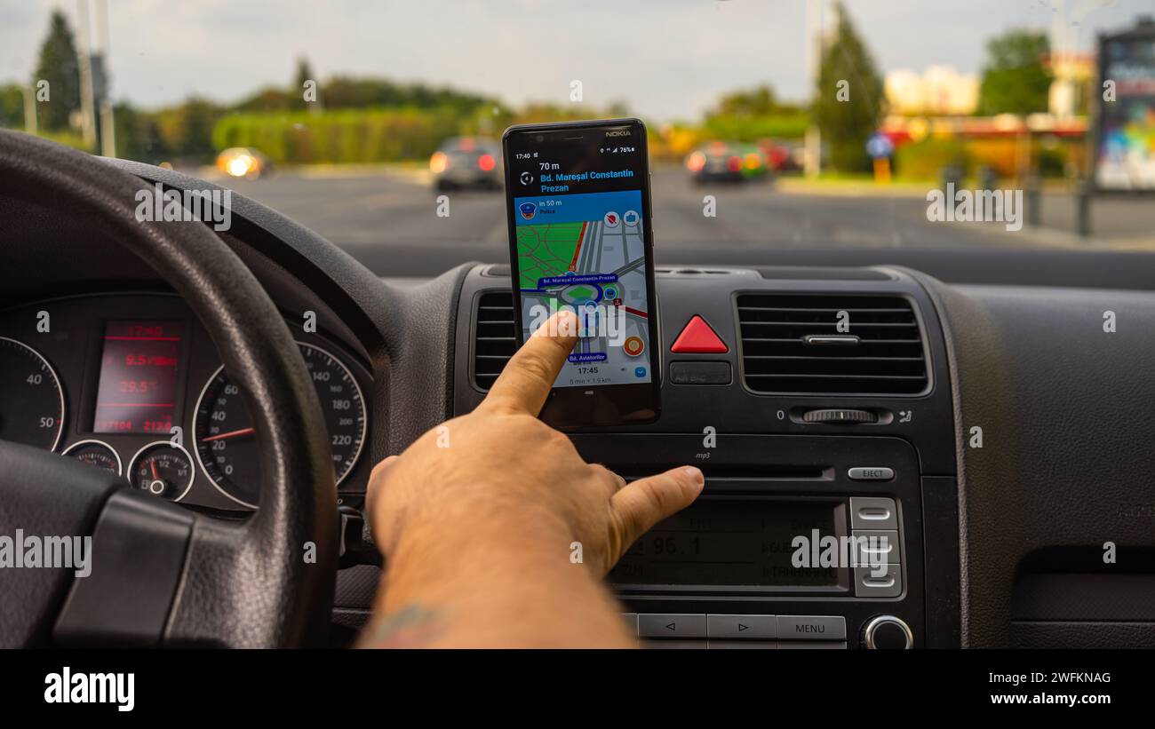 Waze maps showing the way thru the city. Driver using Waze maps Stock ...