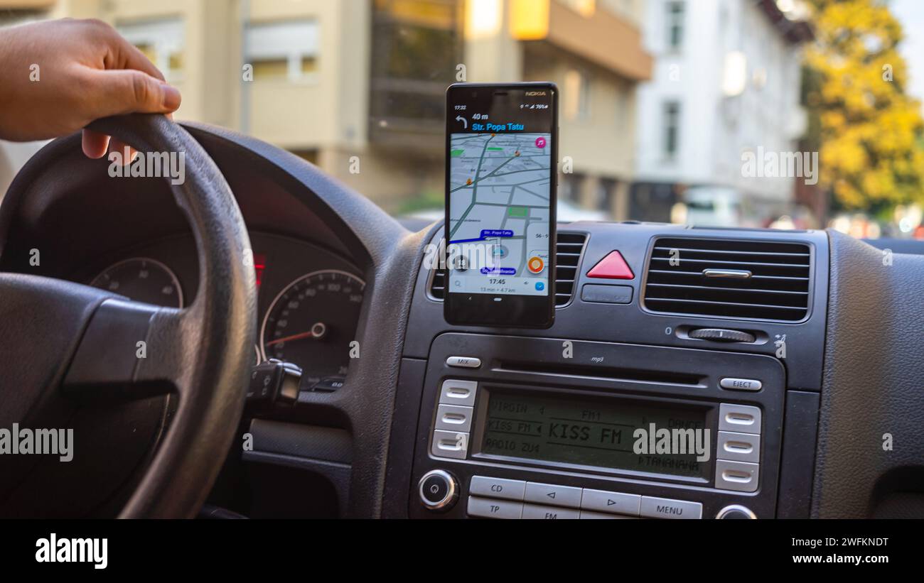 Waze maps showing the way thru the city. Driver using Waze maps Stock ...
