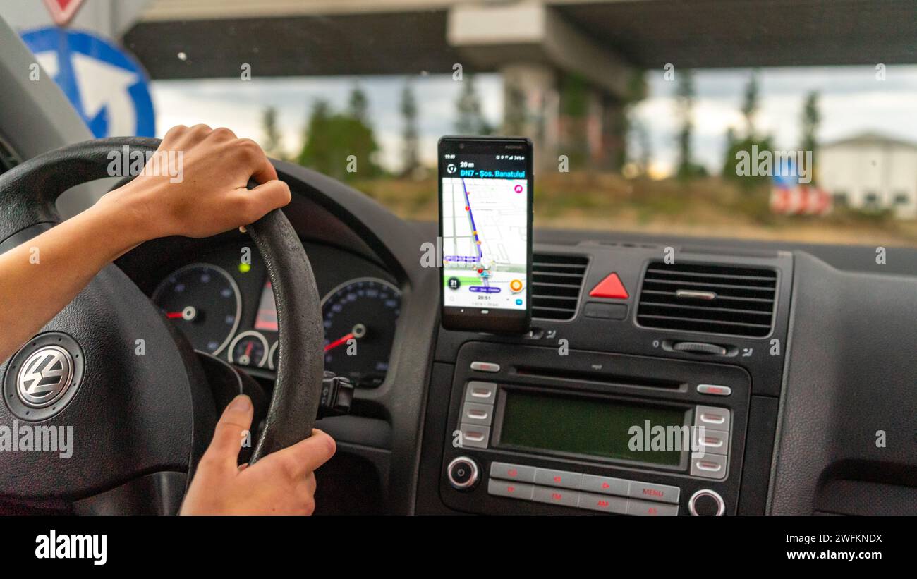 Waze maps showing the way thru the city. Driver using Waze maps Stock ...