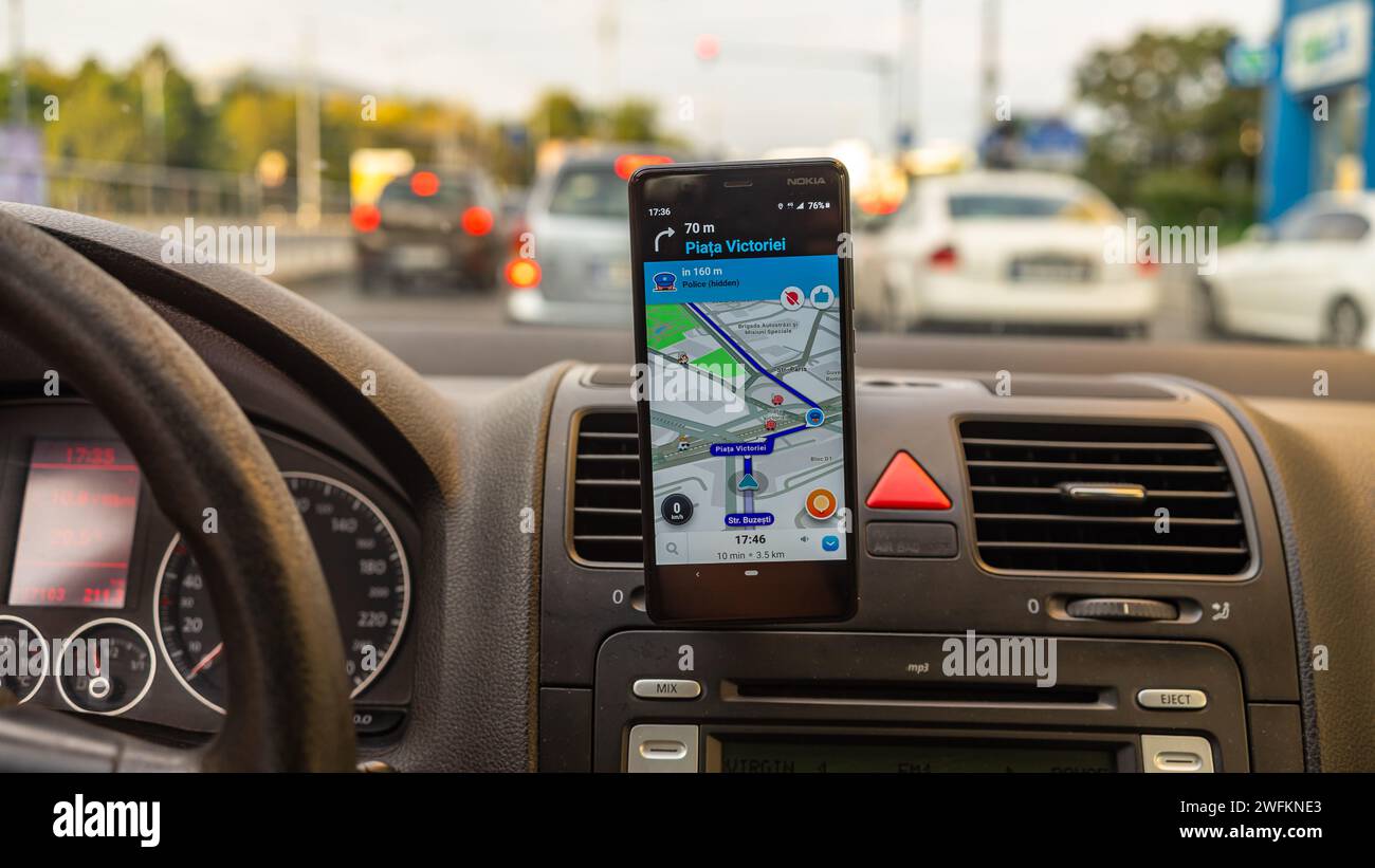 Waze maps showing the way thru the city. Driver using Waze maps Stock ...
