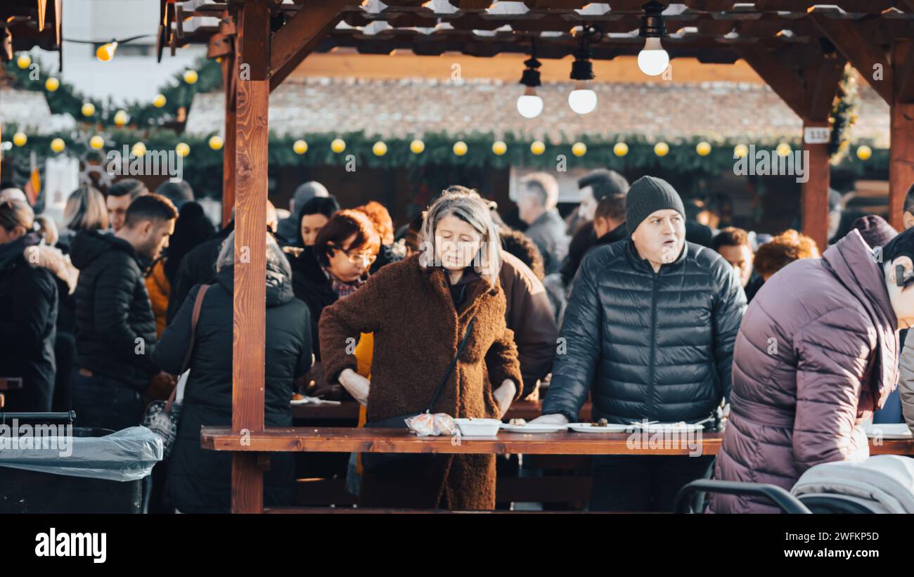 People at Bucharest Christmas Market during winter holiday Stock Photo ...