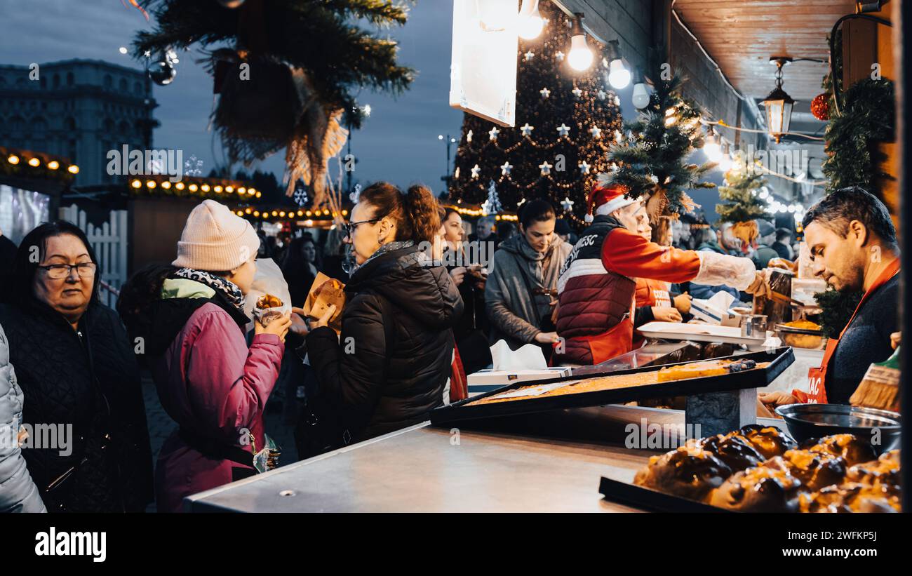 People at Bucharest Christmas Market during winter holiday Stock Photo ...