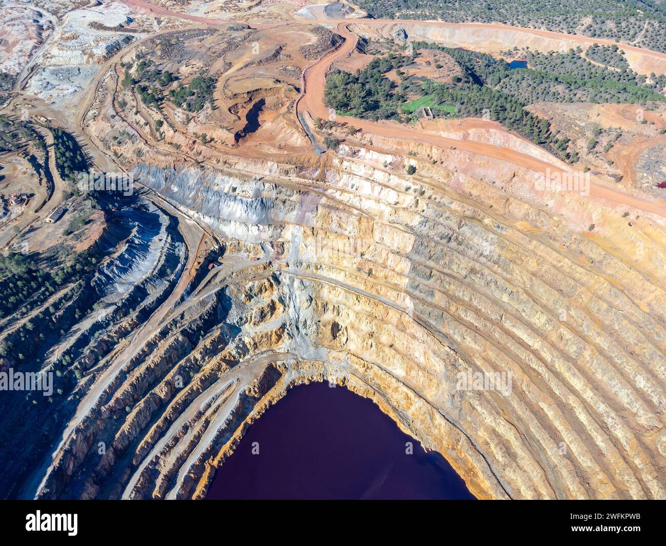 Aerial drone view of Corta Atalaya with mining levels at open mine pit ...