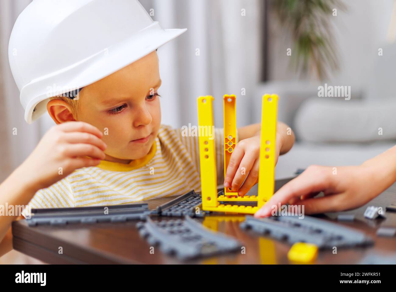 Young Child Engaged in Building Play Stock Photo - Alamy