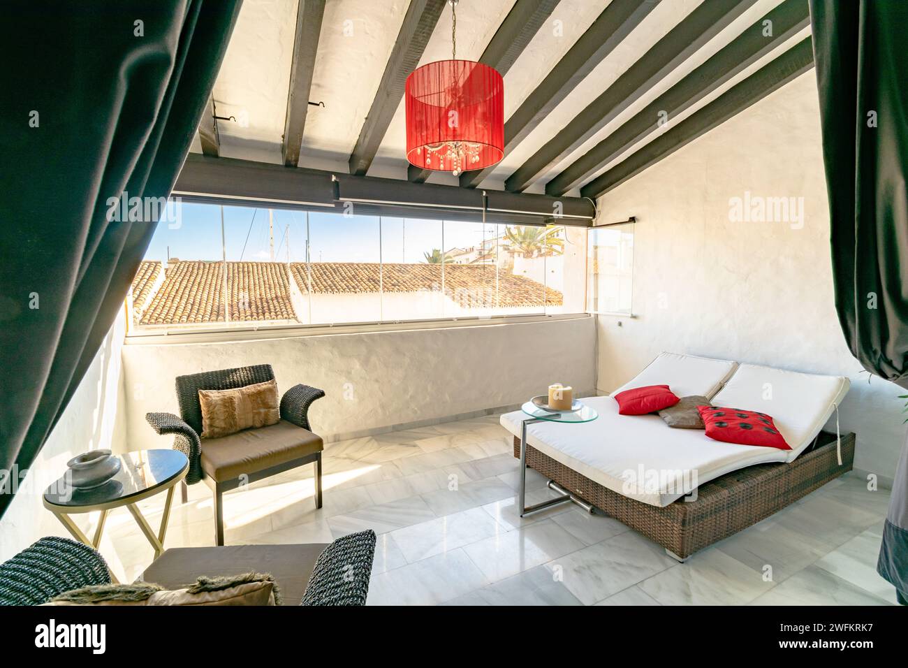 an image of an enclosed balcony terrace with wooden beams on the ...