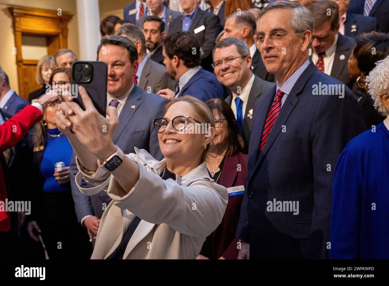 Rep. Esther Panitch, D-Sandy Springs, takes a selfie before Gov. Brian ...