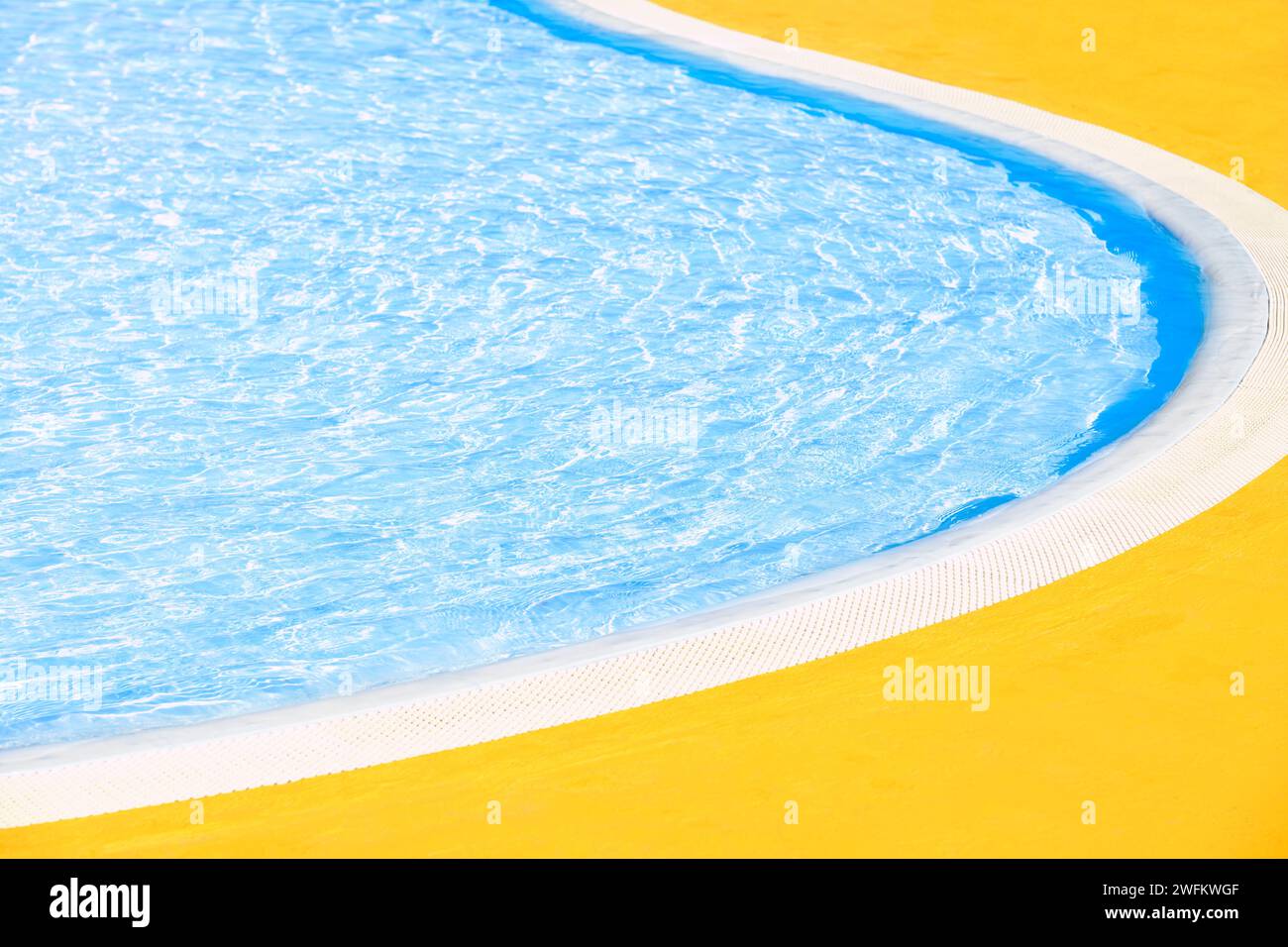 Outdoor swimming pool edge with curved border in sunny summer day ...