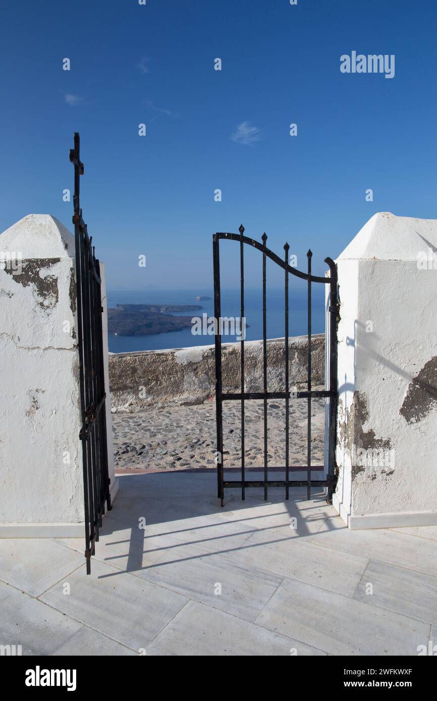 Santorini - The gate of church in Imerovigli with the look to Nea ...