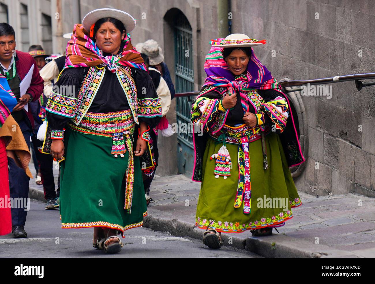 Mollo Indigenous people walk outside the government palace after ...
