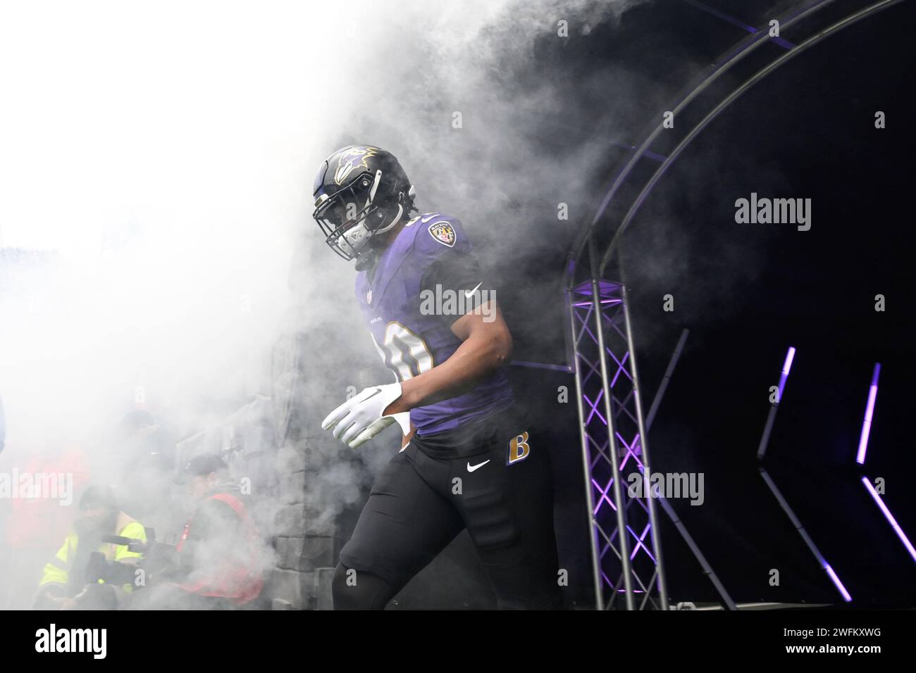 Baltimore Ravens tight end Isaiah Likely runs onto the field during ...