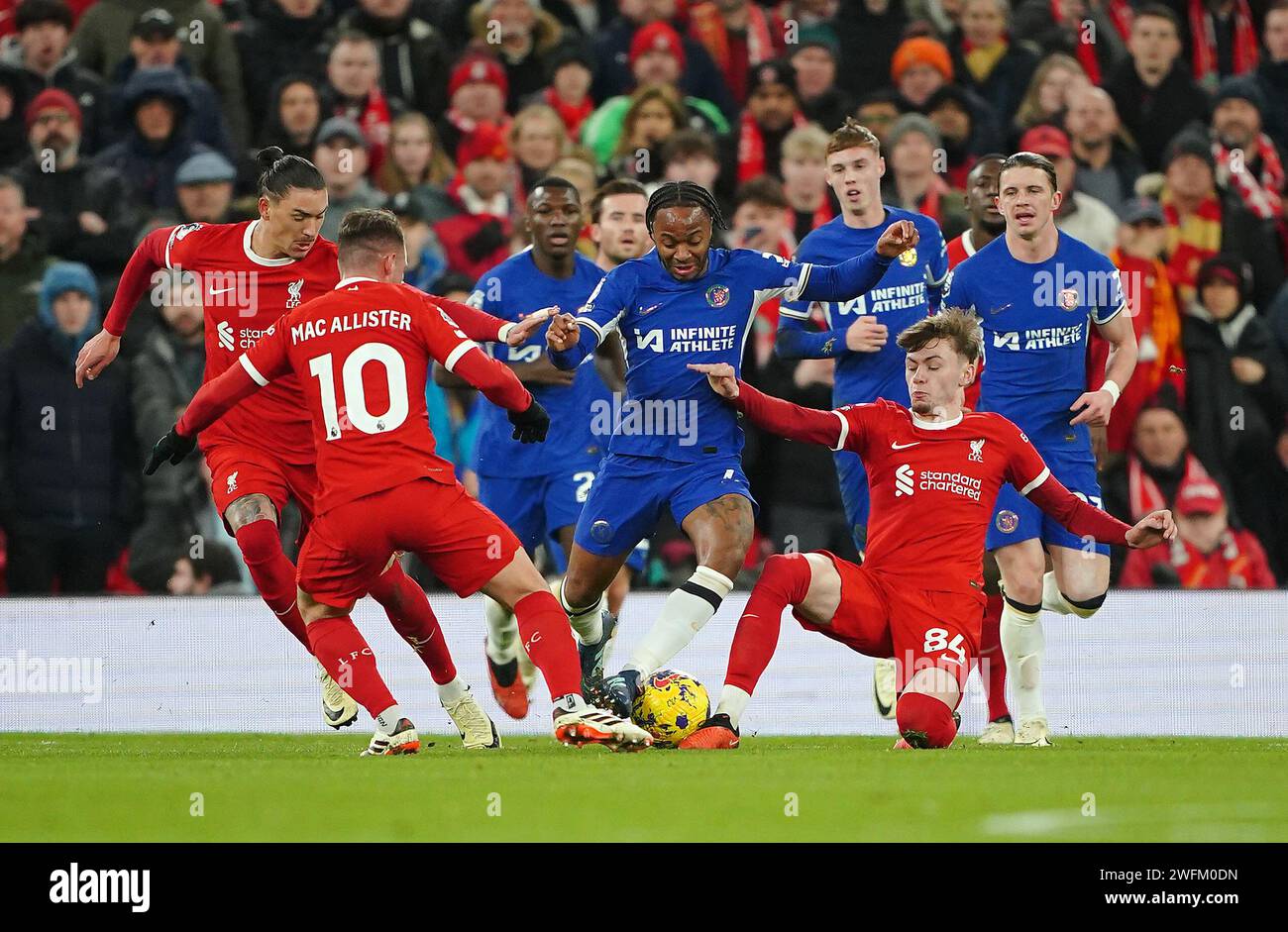 Chelsea's Raheem Sterling is tackled by Liverpool's Alexis Mac Allister ...