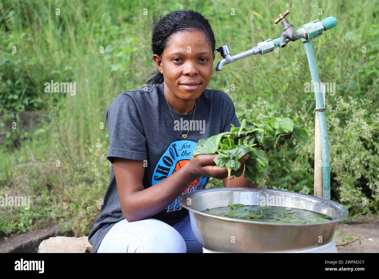 Arusha, Tanzania. 31st Jan, 2024. A resident washes vegetables with ...