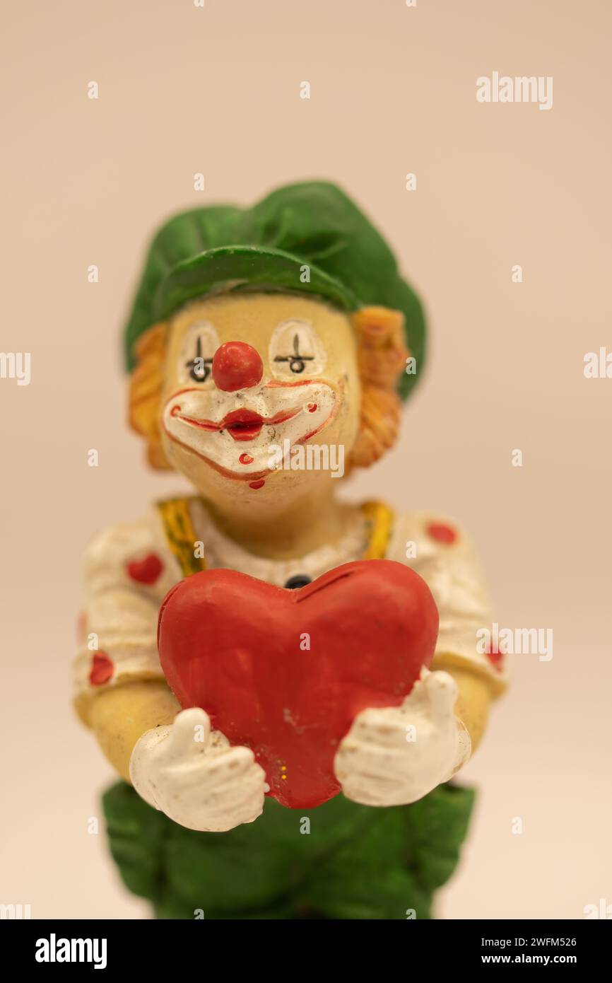 Symbol of love concept. A clown giving al his heart. In love clown ...