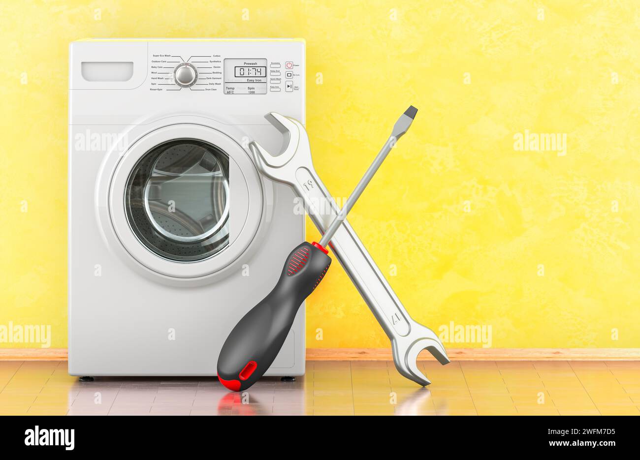 Washing machine with screwdriver and wrench in interior. Repair and ...