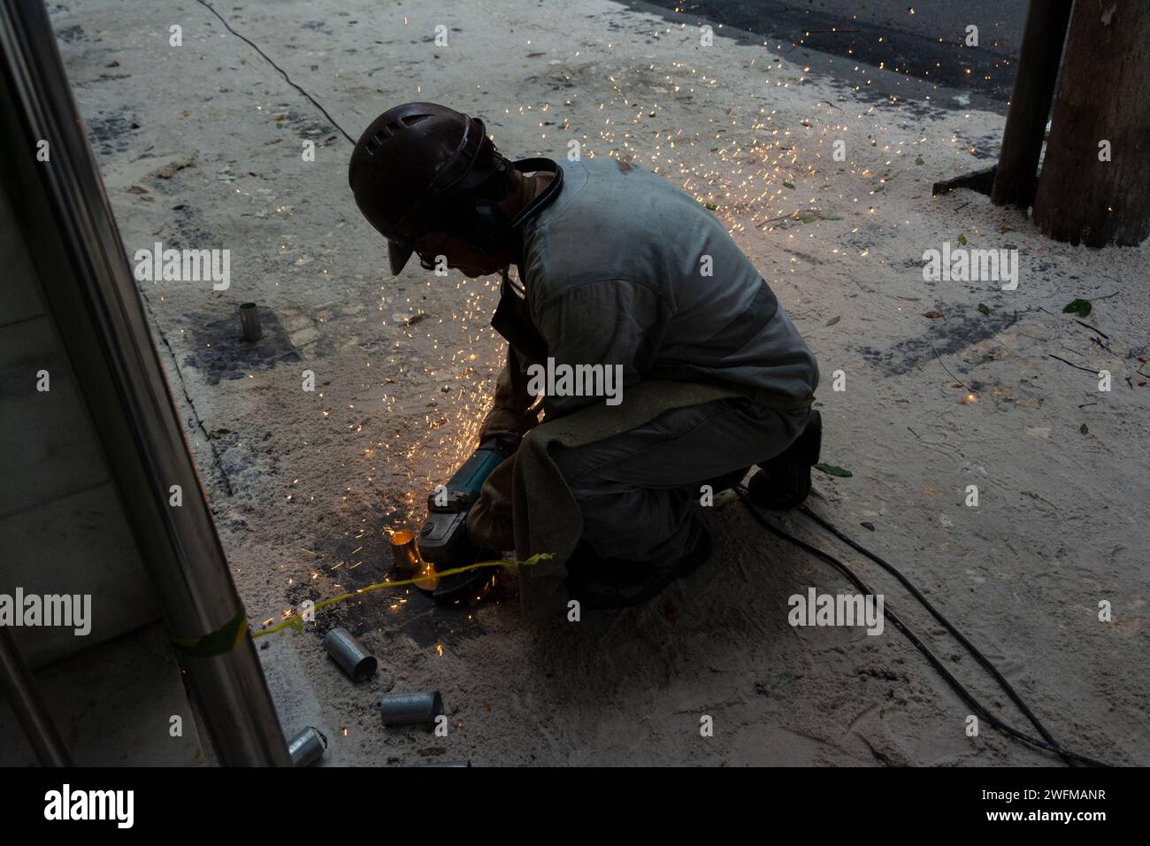 Salvador, Bahia, Brazil - January 25, 2024: A blacksmith worker is seen ...