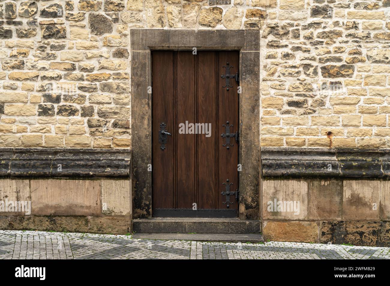 The door of a medieval gothic building made out of wood and metal Stock ...