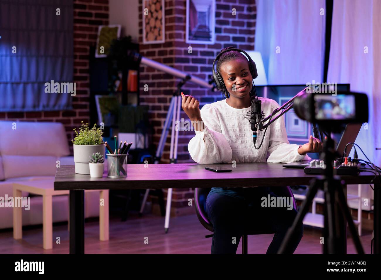 African american vlogger recording internet show using modern camera ...