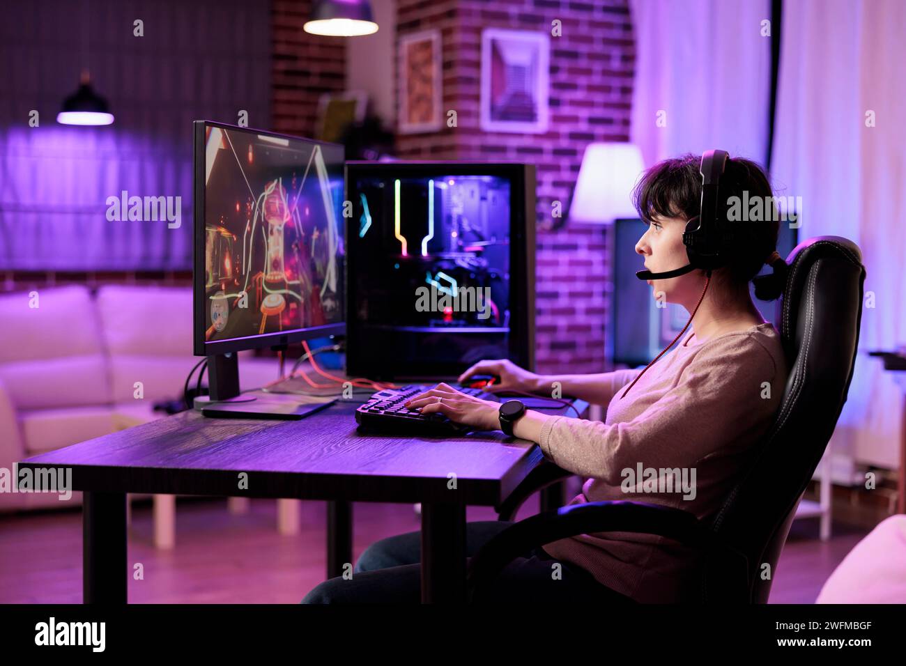 Pro streamer playing videogames on gaming pc, streaming live action ...