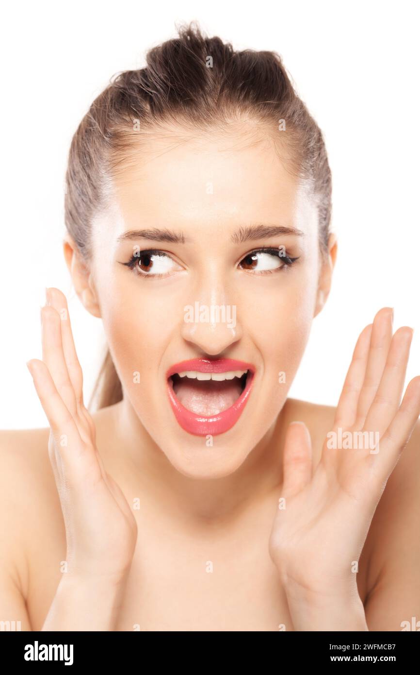 Beautiful girl studio portrait. Making hand gestures and face ...