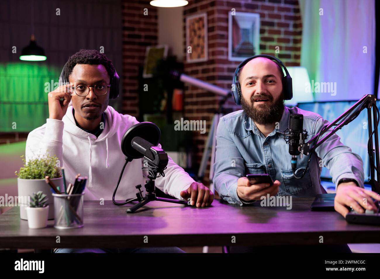 Skillful cohosts presenting entertaining show in professional studio produced for streaming ...