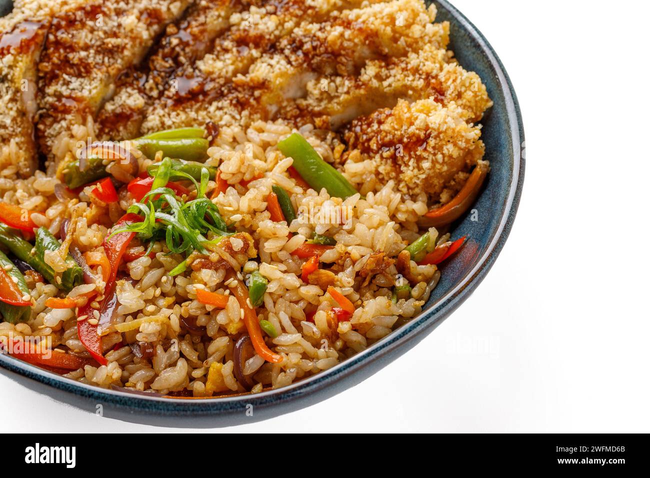 Hibachi rice with chicken schnitzel on a white background studio food ...