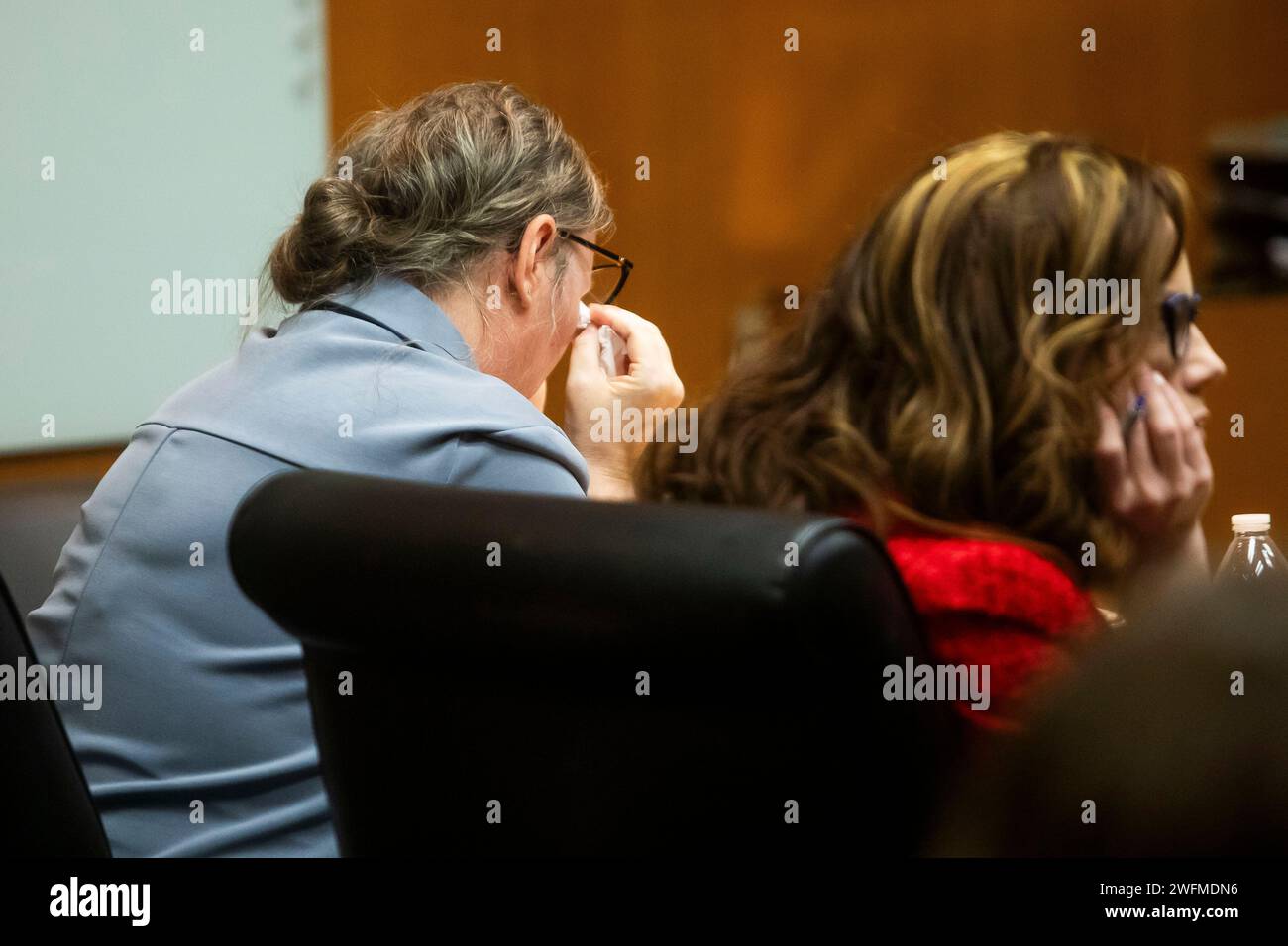 Defendant Jennifer Crumbley, left, wipes tears from her eyes while ...