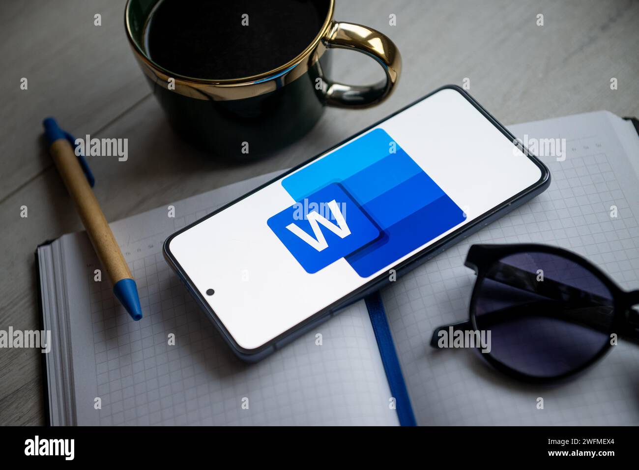 In this photo illustration a Microsoft Word logo seen displayed on a ...