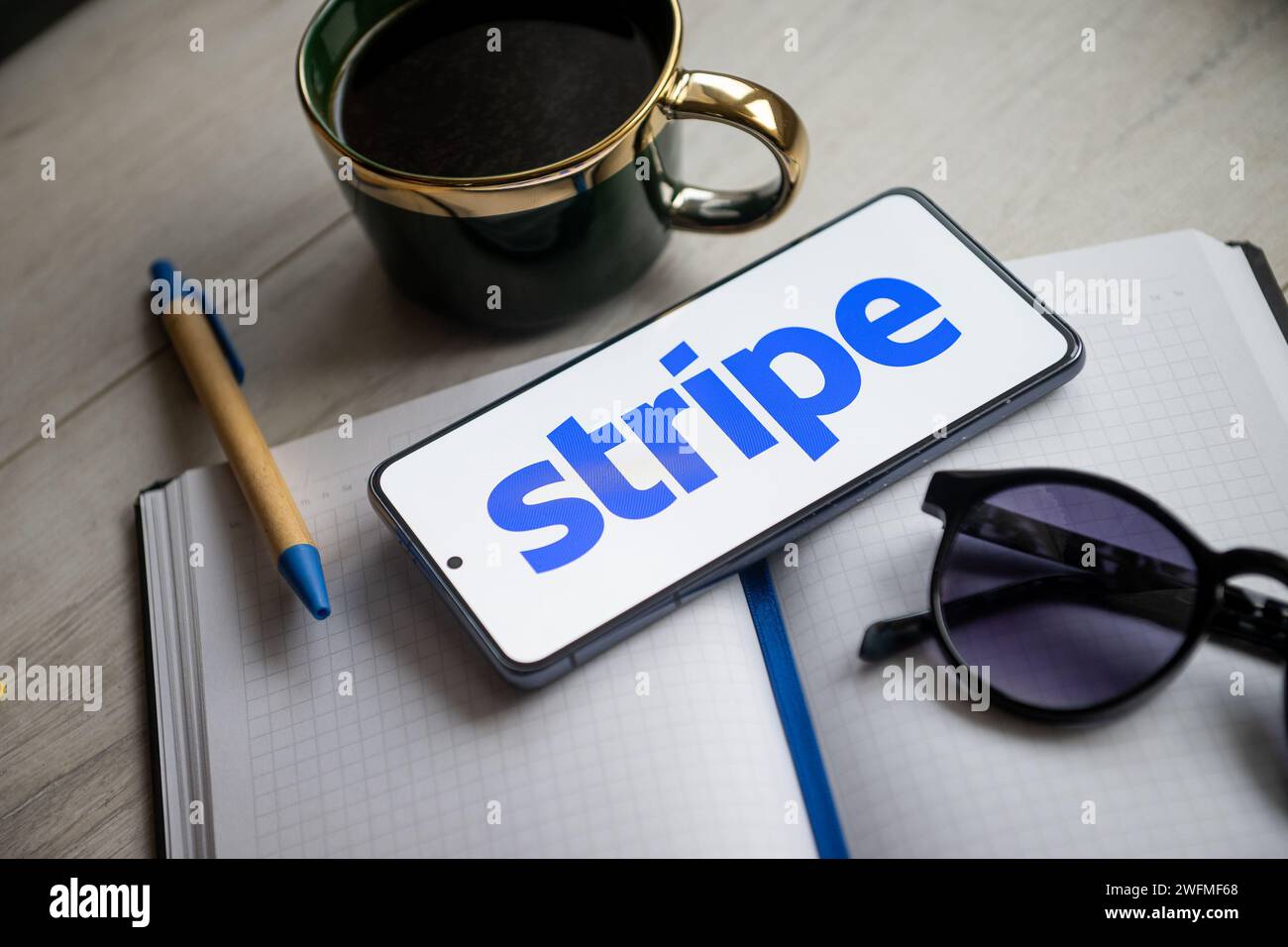 In this photo illustration a Stipe logo seen displayed on a smartphone ...