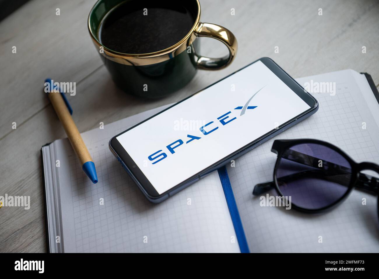 In this photo illustration a SpaceX logo seen displayed on a smartphone ...